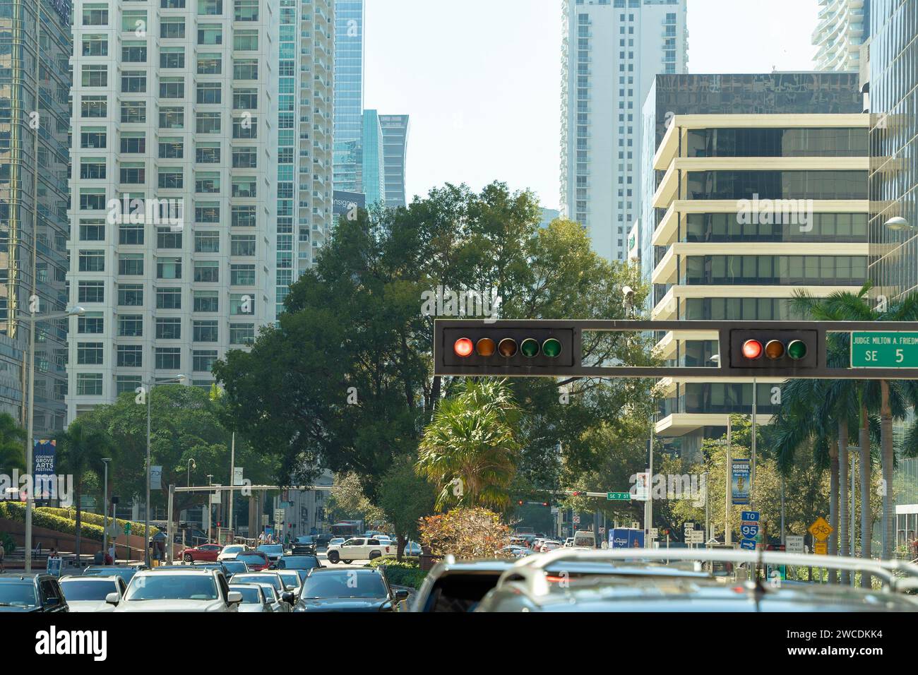 Traffic lights regulating driving cars on city street in Miami, Florida ...