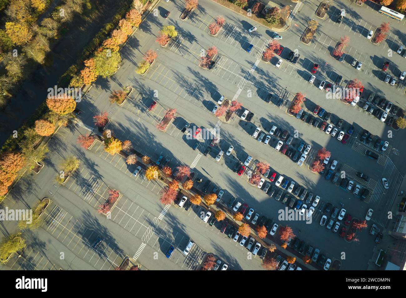 View from above of many parked cars on parking lot with lines and ...