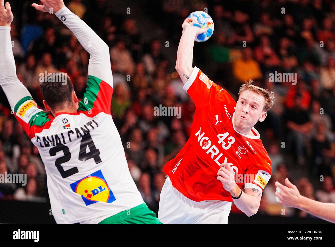 Denmarks Simon Pytlick and Portugals Cavalcanti during the mens EHF ...