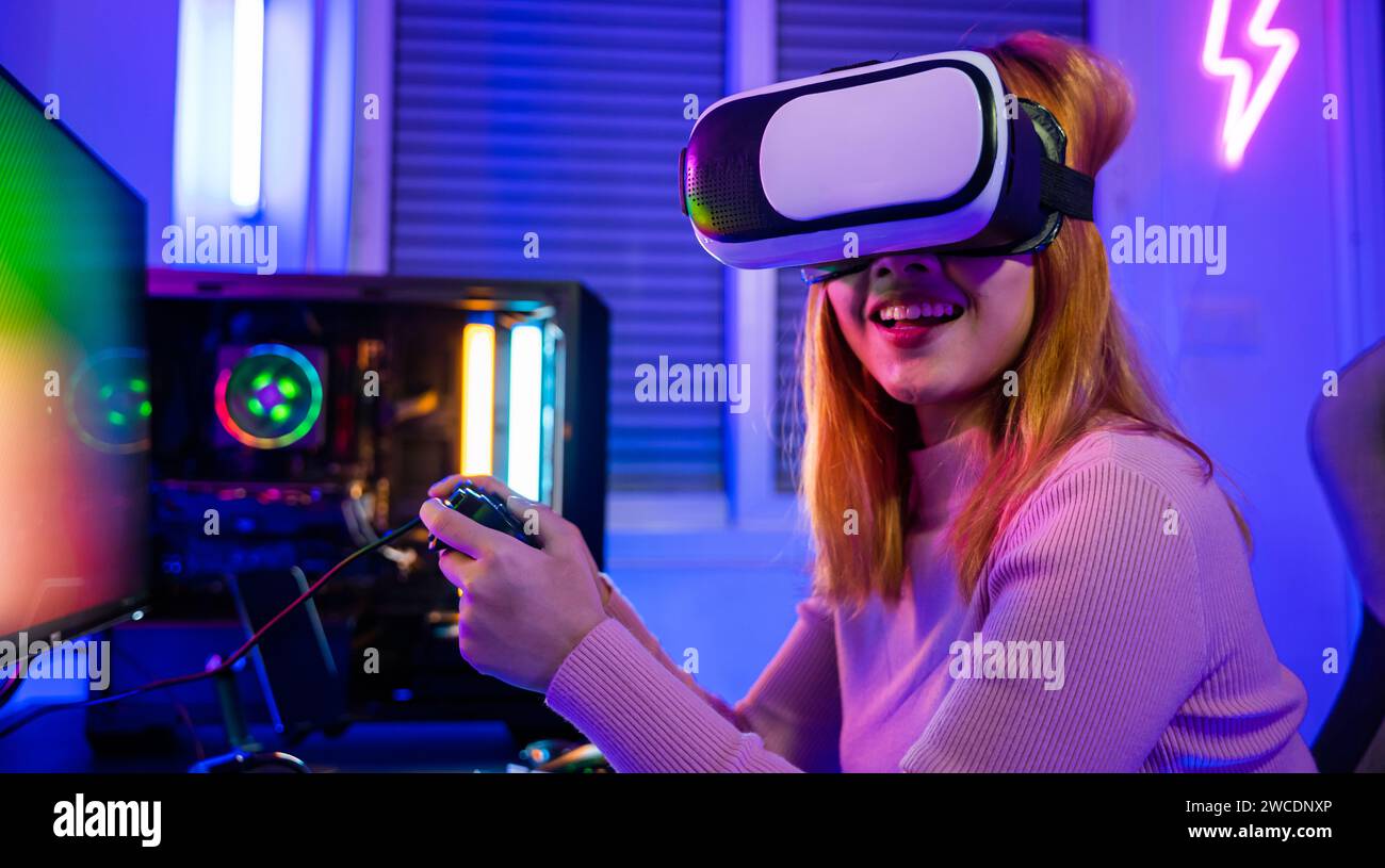 Gamer in VR headset glasses exploring metaverse play video game online ...