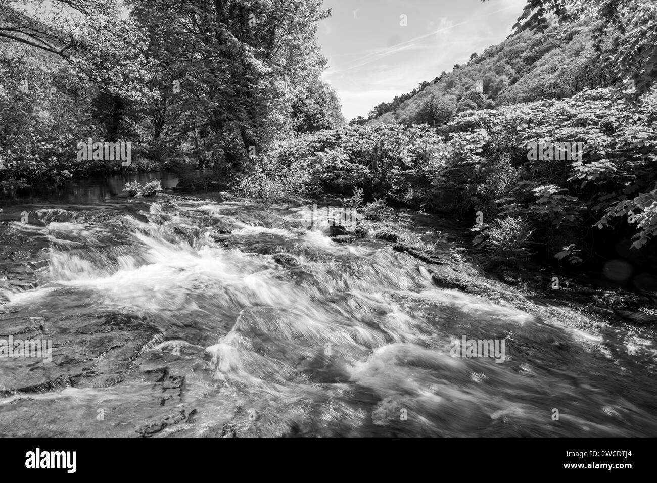 Long exposure of a waterfall on the East Lyn river flowing through the ...