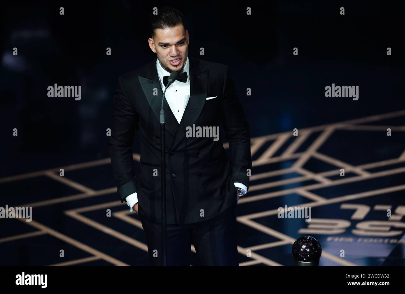 Ederson on stage after receiving the award for The Best Men's ...