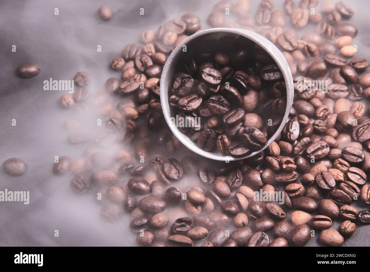 Image of coffee beans on background with smoke Stock Photo - Alamy