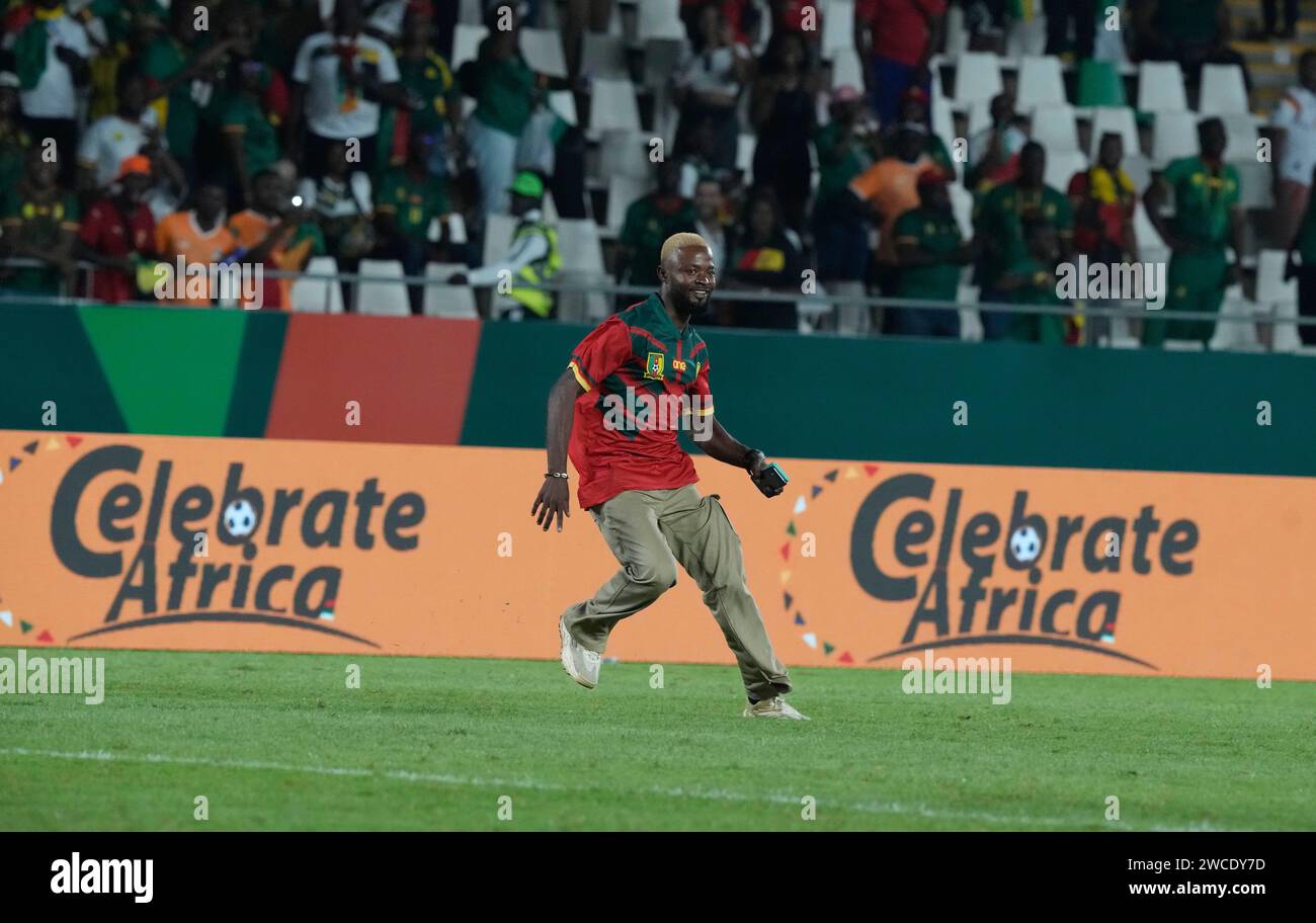 A Guinea supporter invades the soccer pitch after the African Cup of ...