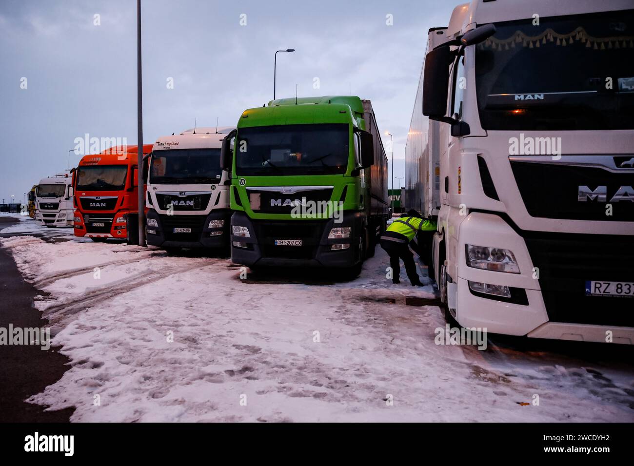 Medyka, Poland, January 15, 2024. A truck driver checks his truck as he ...