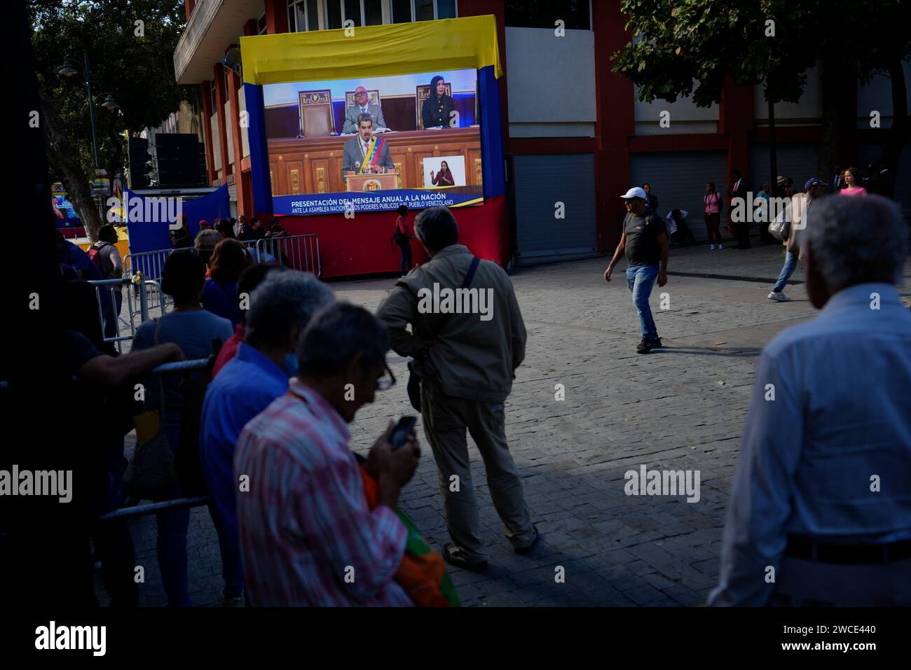 People watch Venezuelan President Nicolas Maduro deliver his annual ...