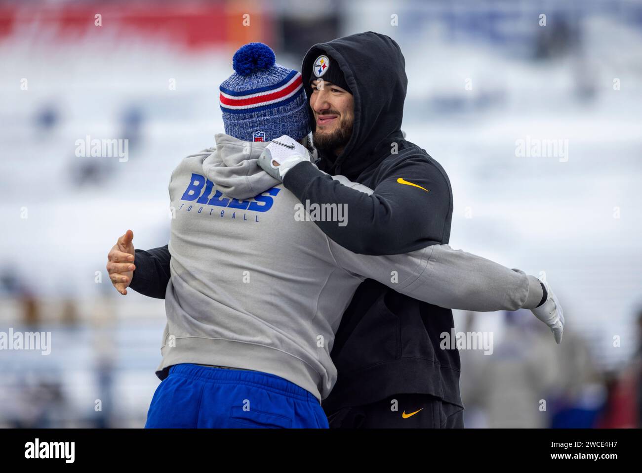 Pittsburgh Steelers quarterback Mitch Trubisky (10) greets Buffalo Bills fullback Reggie Gilliam ...