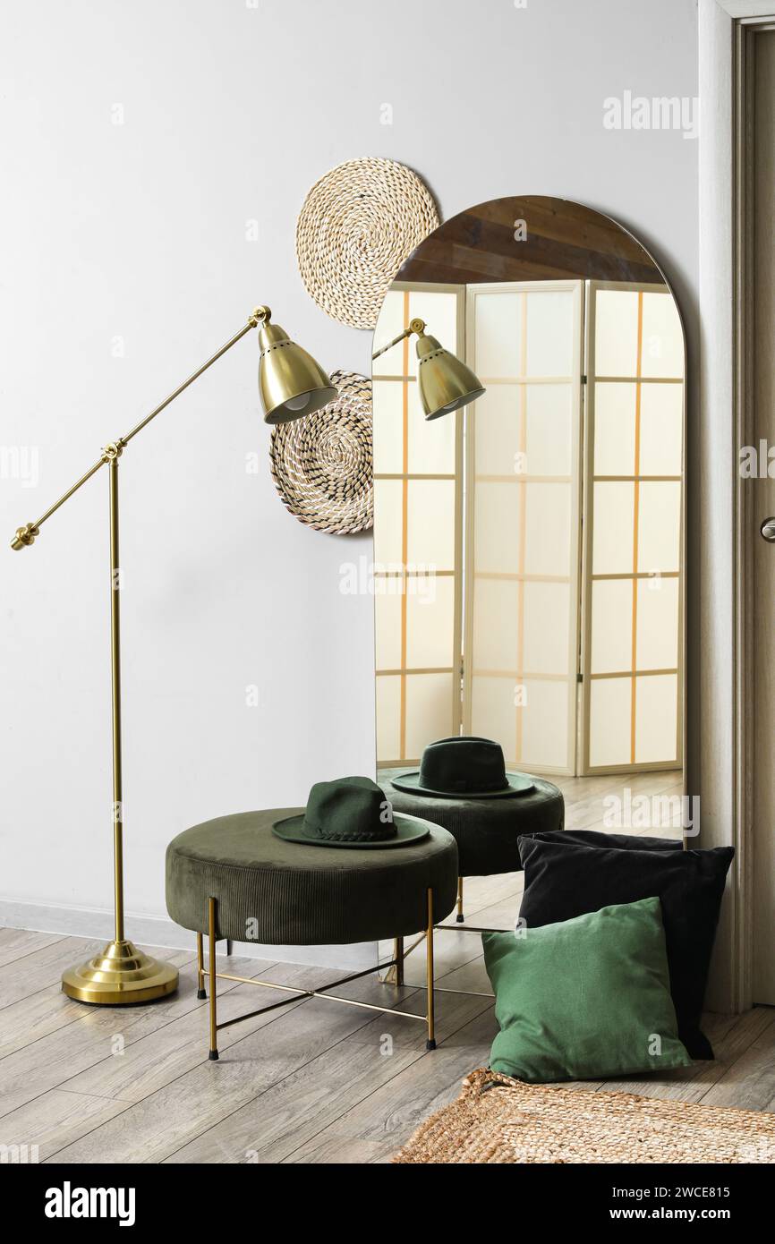 Interior of hallway with mirror, door and pouf Stock Photo - Alamy