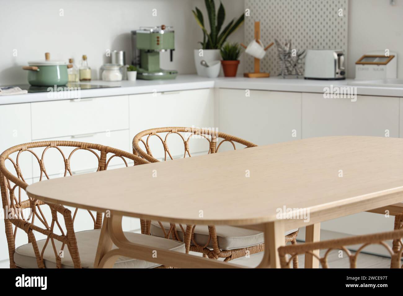 Clean wooden table in interior of modern kitchen Stock Photo - Alamy