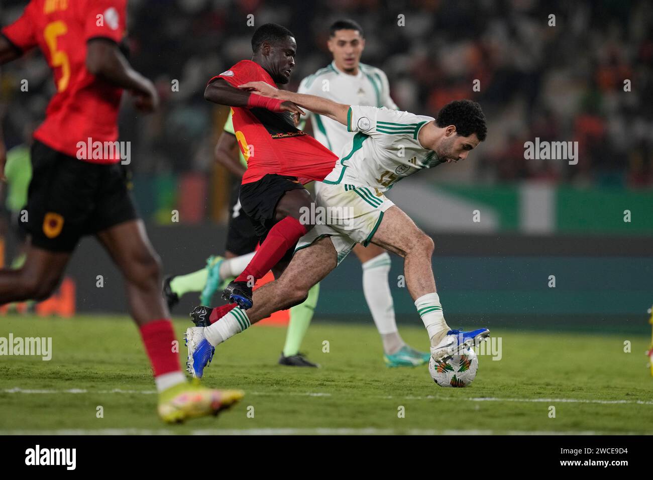 Angola's Zito Luvumbo, centre left, challenges for the ball with ...