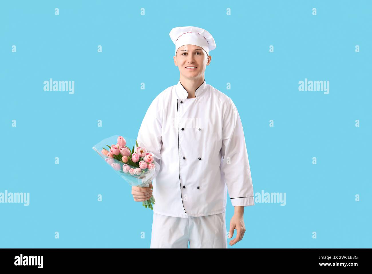 Male chef with tulips on blue background. International Women's Day ...
