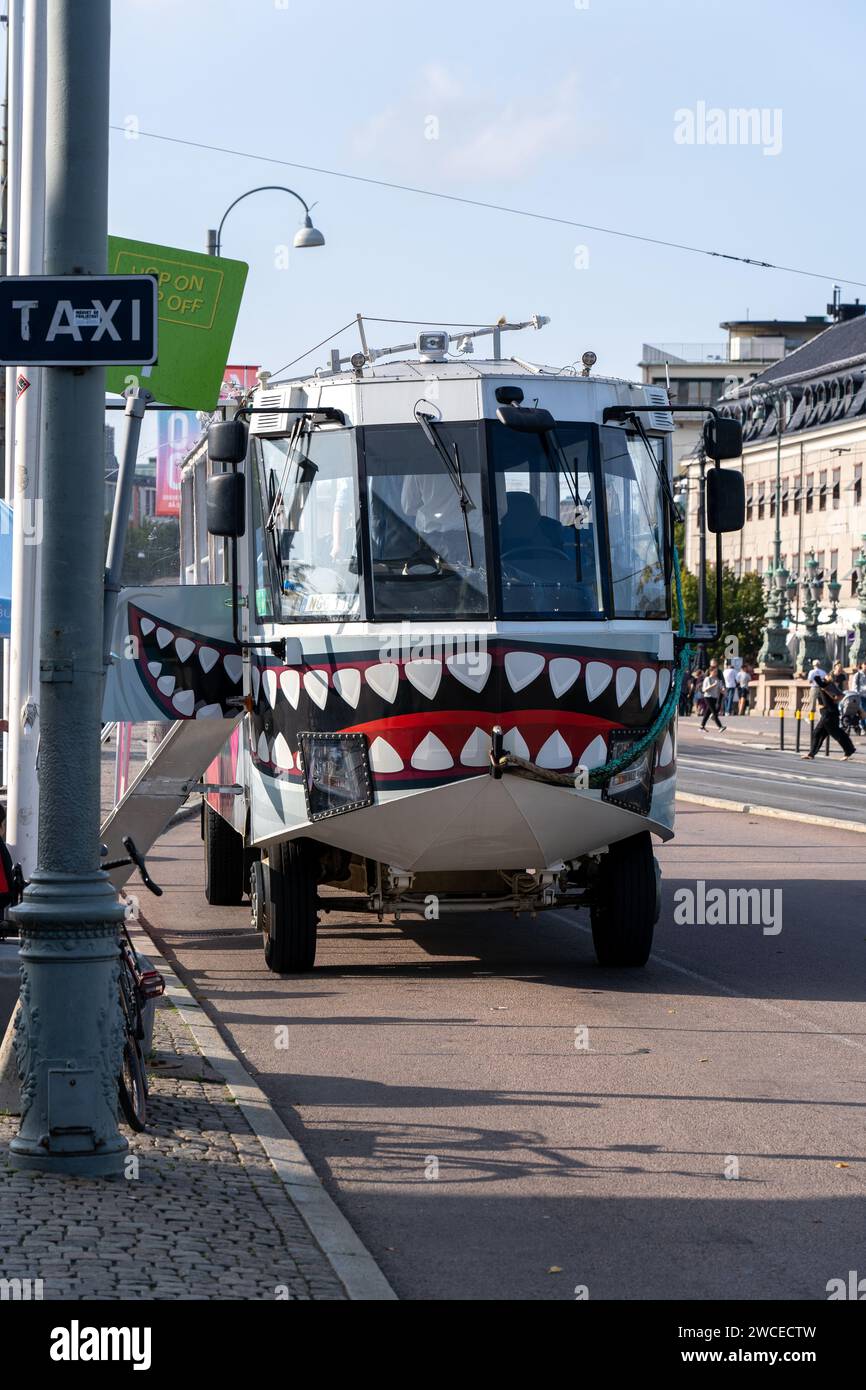 A massive city bus adorned with unique dental-themed artwork featuring ...