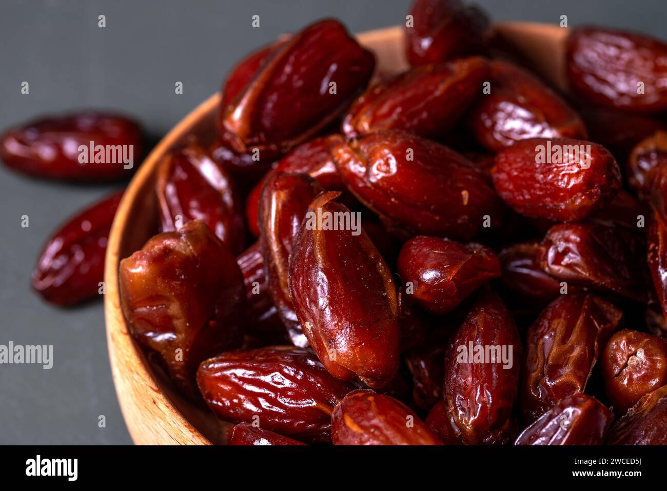 fruits dates. dried dates in a wood pot Stock Photo - Alamy