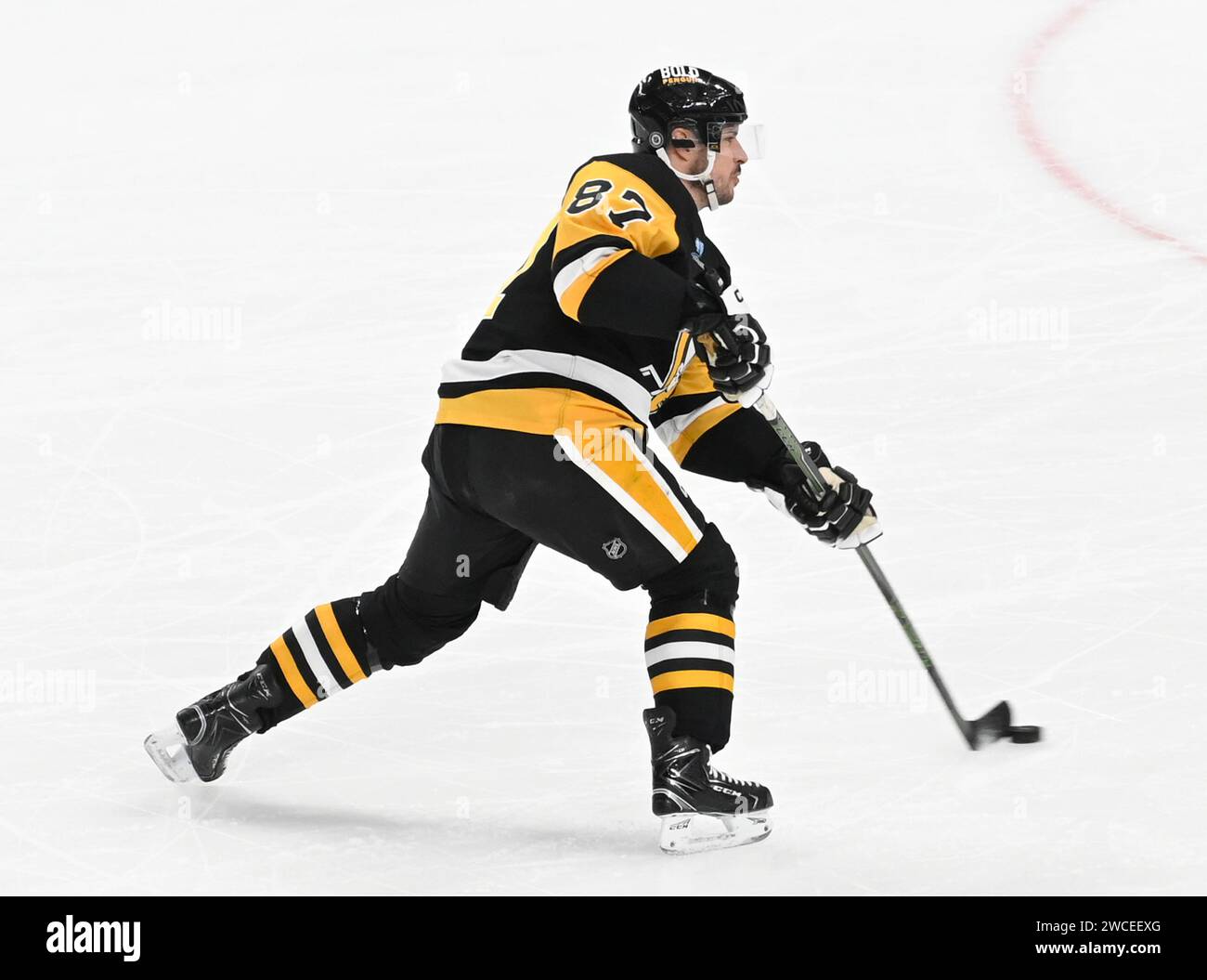 Pittsburgh Penguins center Sidney Crosby takes a slap shot on goal ...