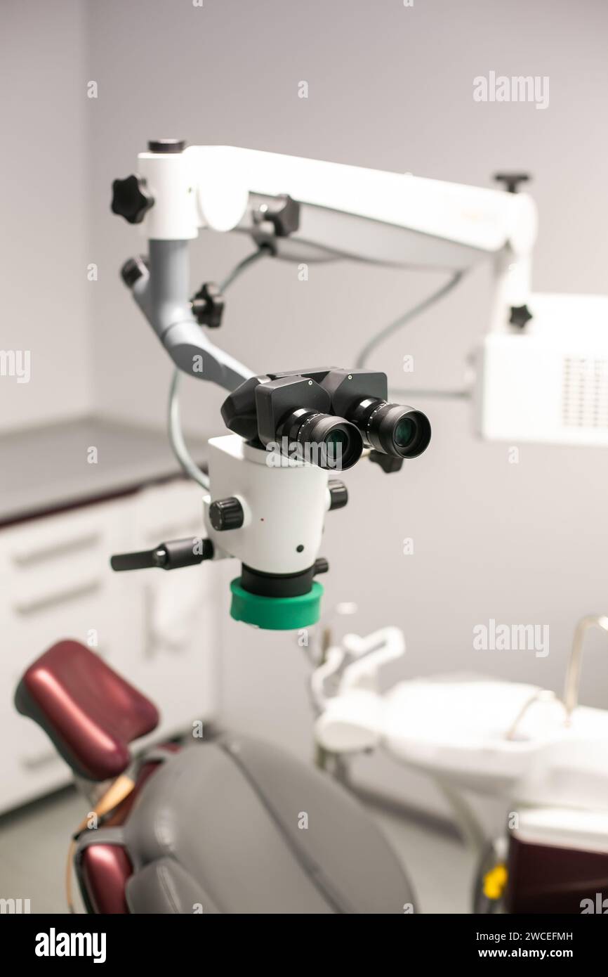 Dental microscope on the background of modern dentistry. Medical ...