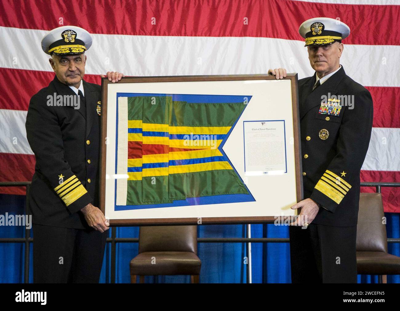 NORFOLK (Dec. 7, 2021) Adm. Christopher Grady, right, accepts a ...