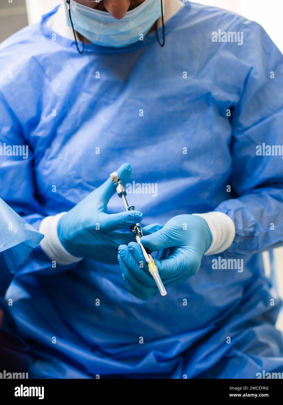 dentist man holding dental syringe ready for use operation Stock Photo ...