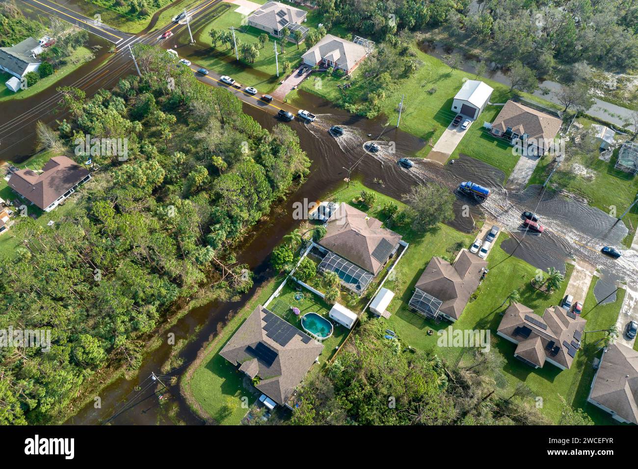 Surrounded by hurricane rainfall flood waters homes in Florida ...