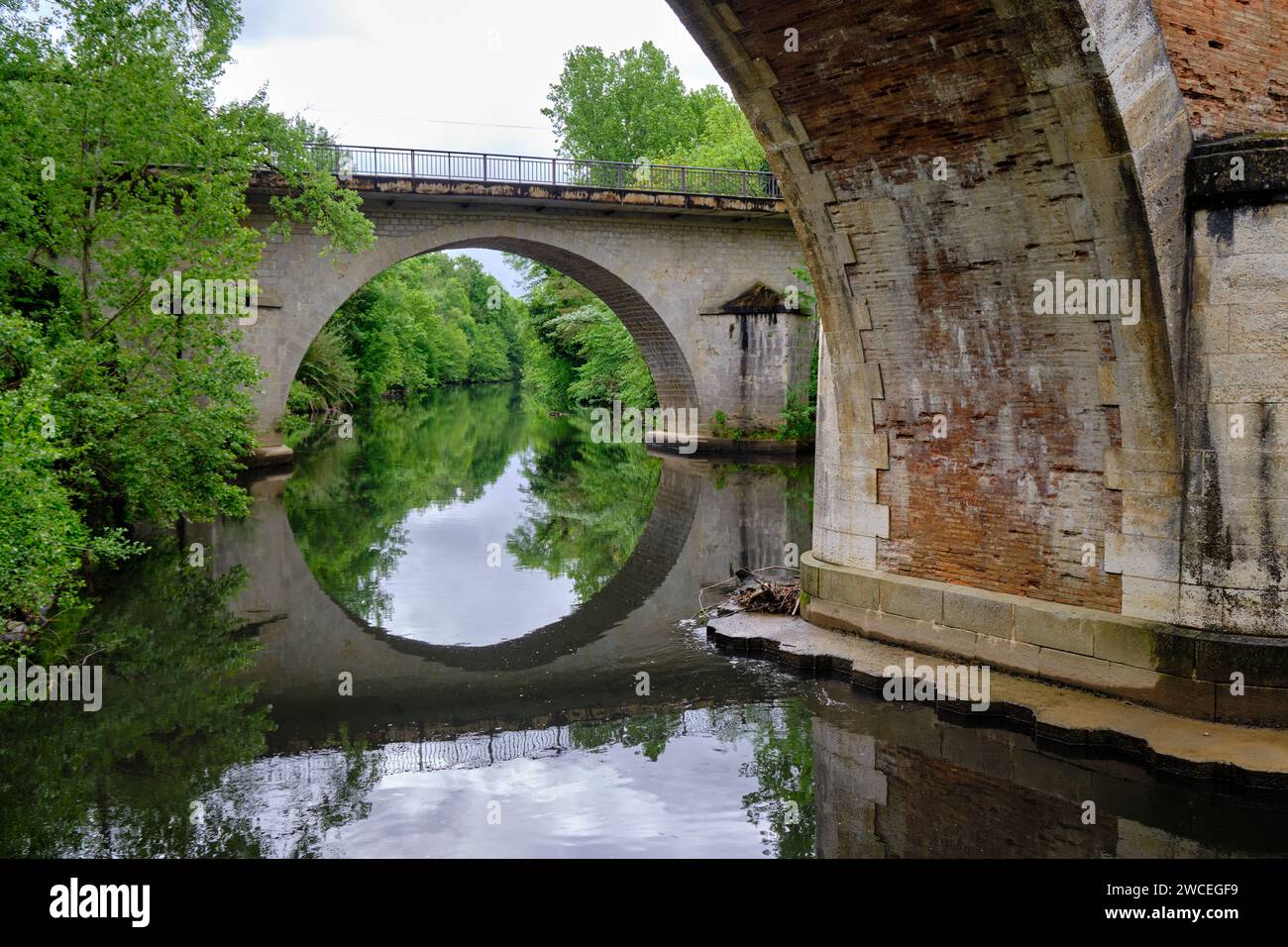 Vintage arched rail bridge, as it crosses the Thoré river, just outside of Castres, France Stock ...