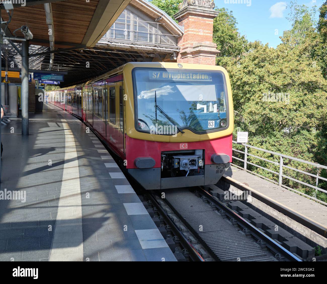 S-Bahn train on outdoor elevated platform station, Berlin, Germany ...