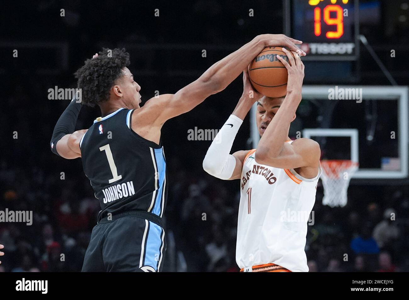 Atlanta Hawks forward Jalen Johnson (1) blocks San Antonio Spurs center ...