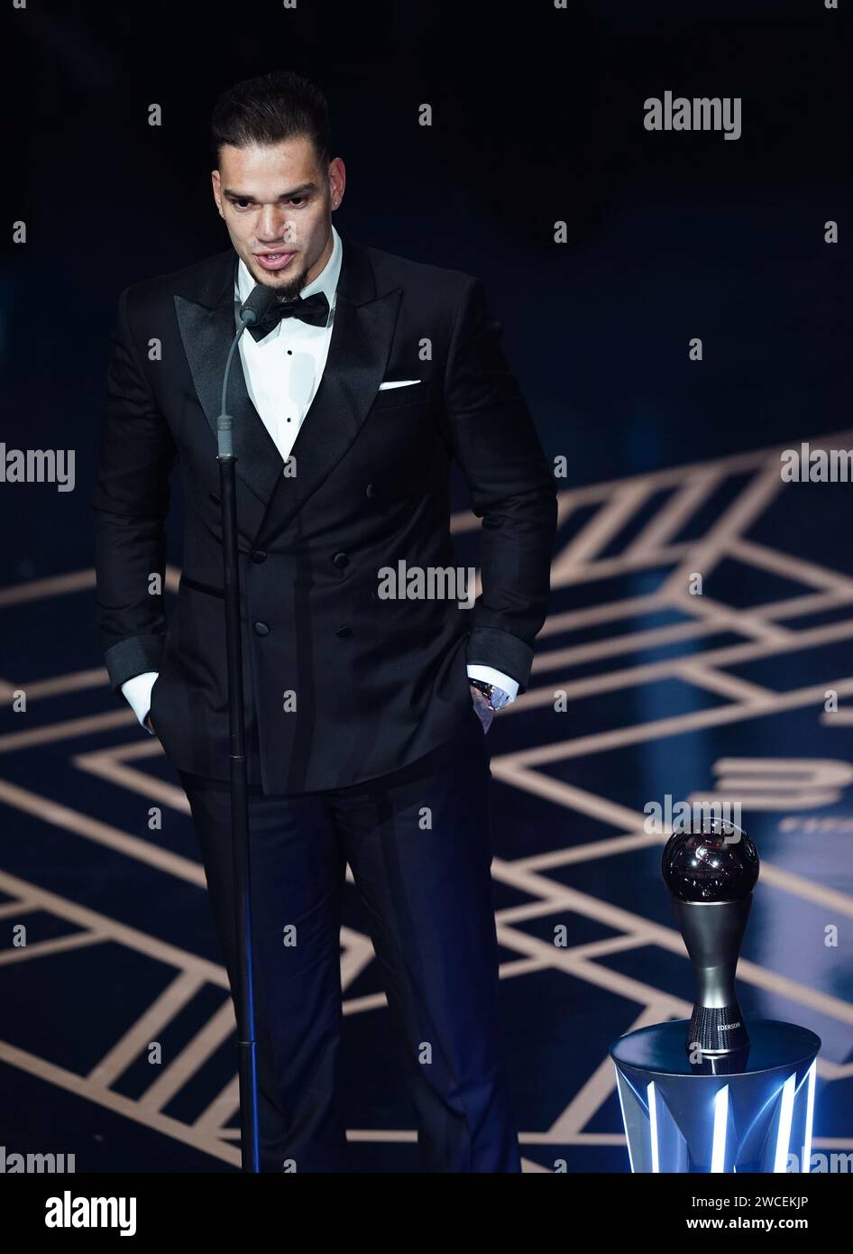 Ederson on stage after receiving the award for The Best Men's ...