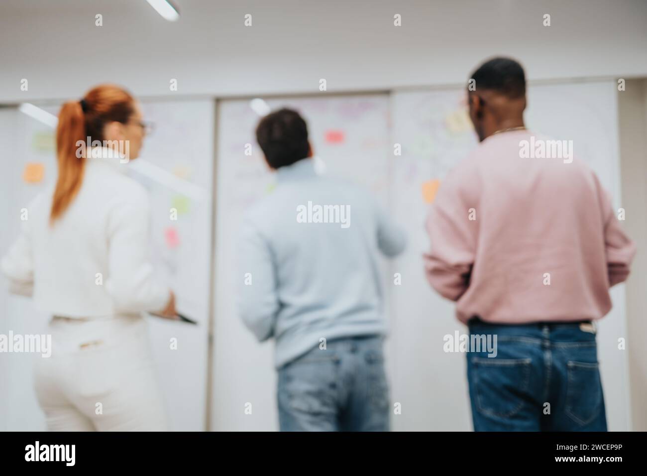 Creative collaboration in a corporate office with diverse colleagues ...