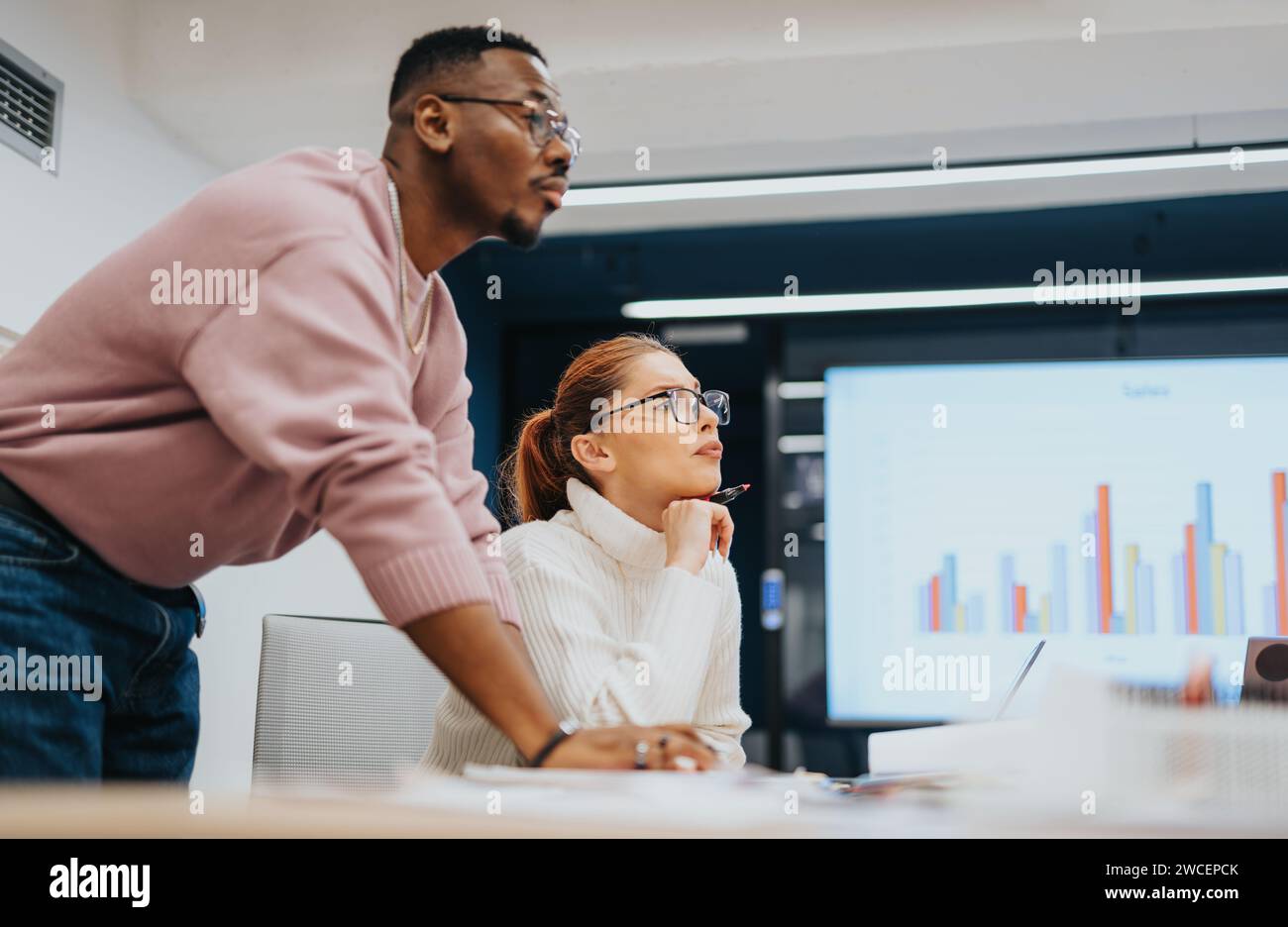 Multiracial colleagues collaborating on brainstorming session in corporate office Stock Photo ...