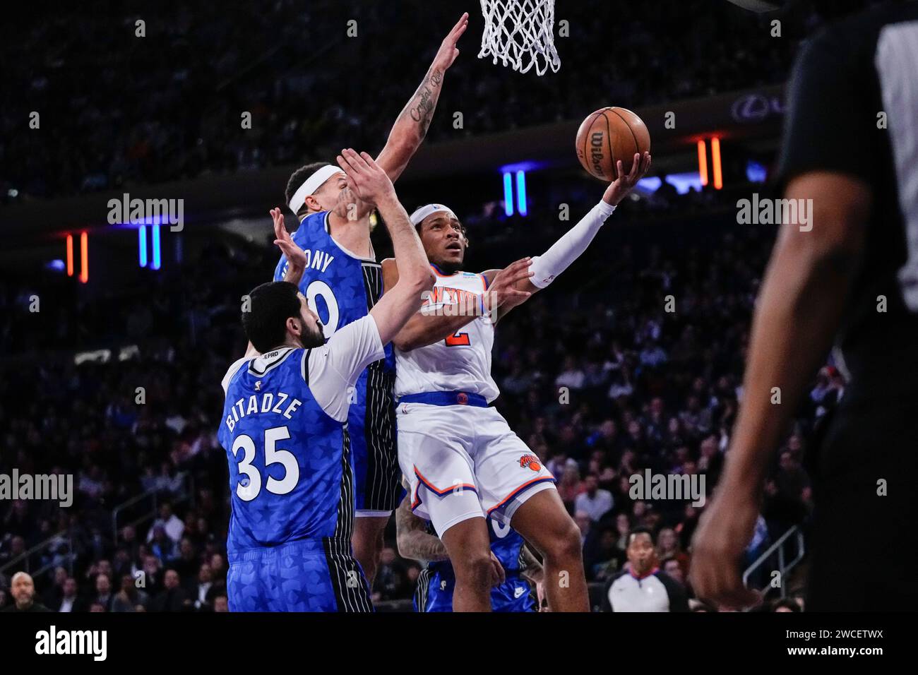 New York Knicks' Miles McBride, center right, drives past Orlando Magic ...