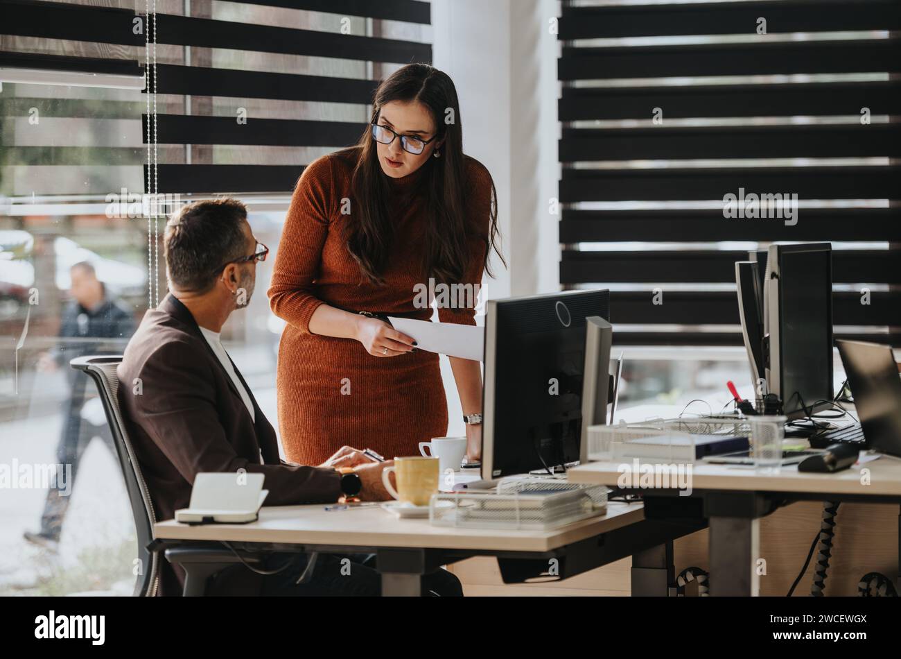 Multicultural business team collaborates on analysis, growth strategies ...