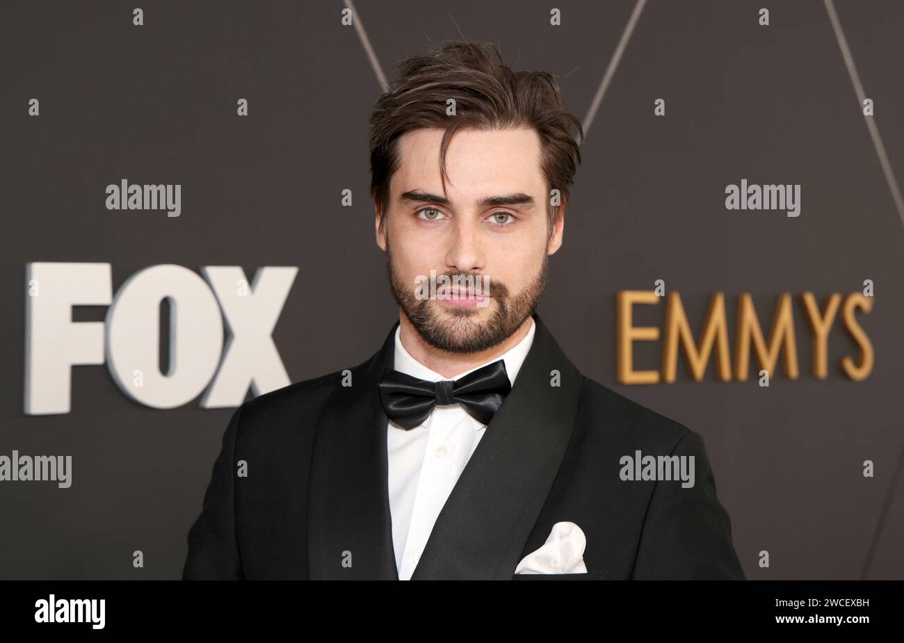 Stephen Manas walks the red carpet at the 75th Emmy Awards on Monday ...