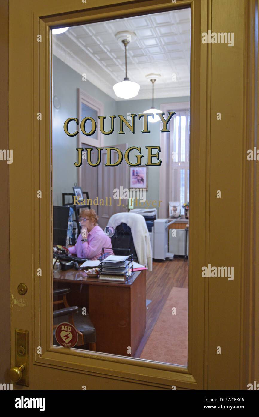 Woman hard at work inside the county judge office in Lampasas County ...