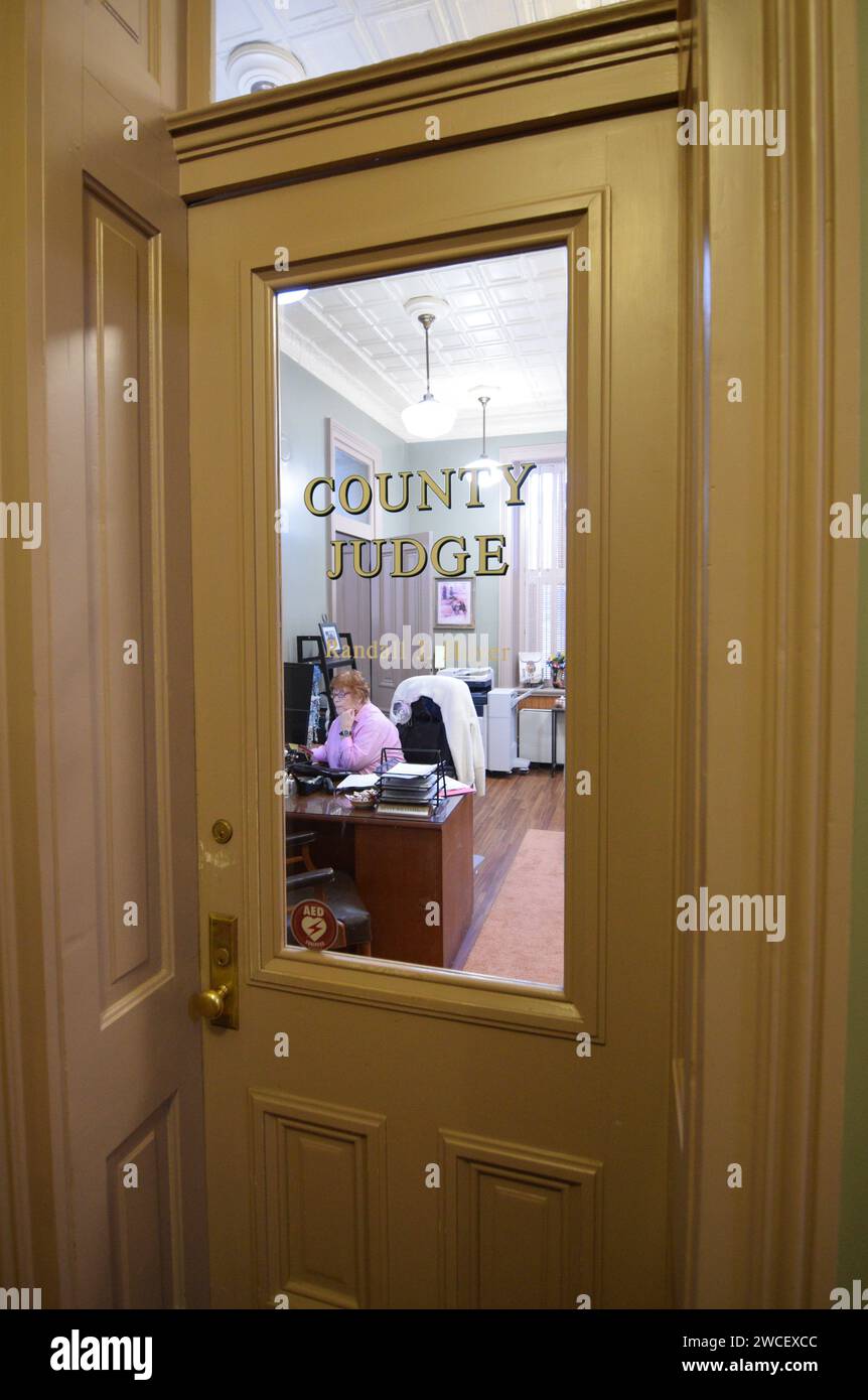 Woman hard at work inside the county judge office in Lampasas County ...