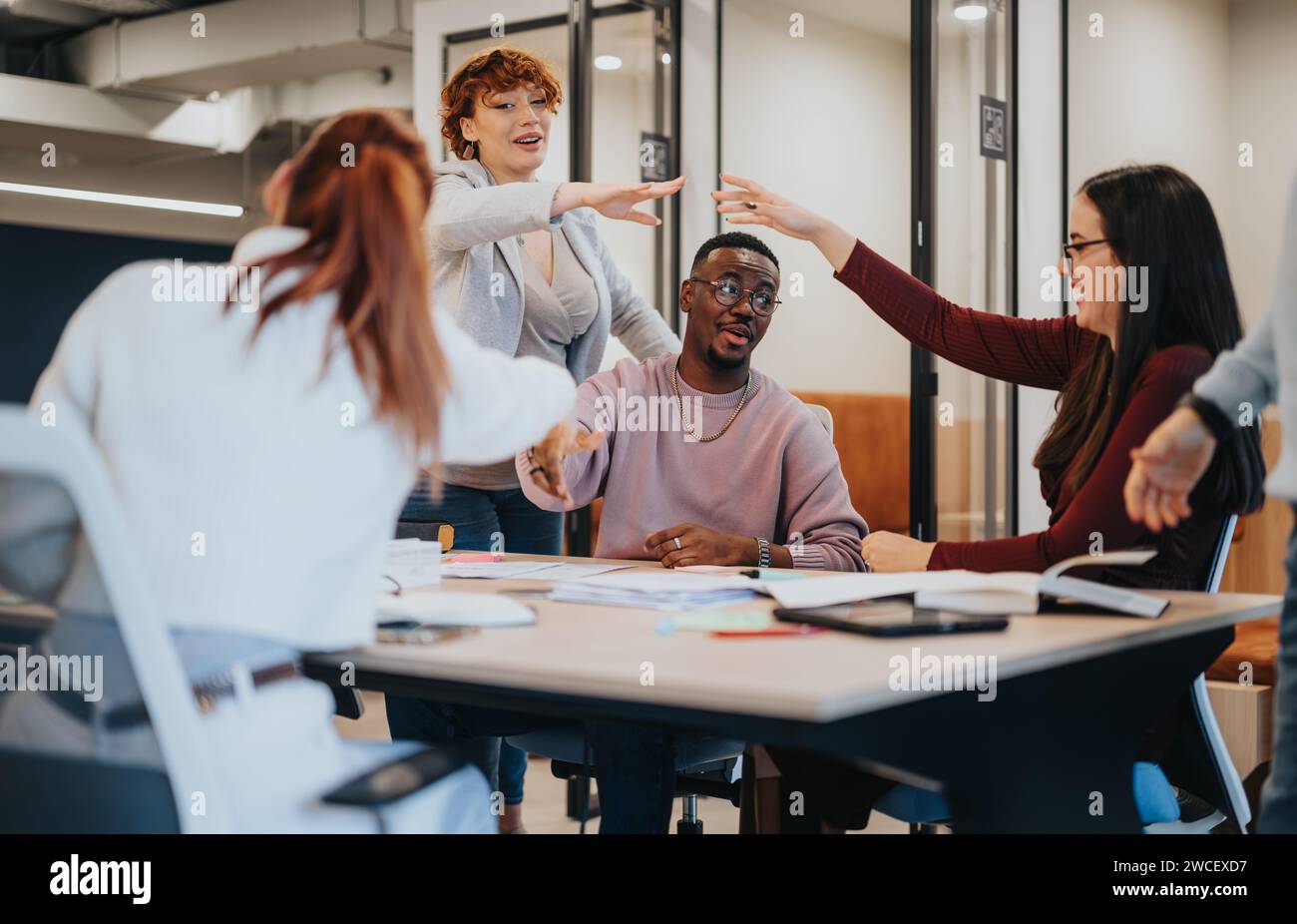 Business colleagues celebrating successful completion of a project ...