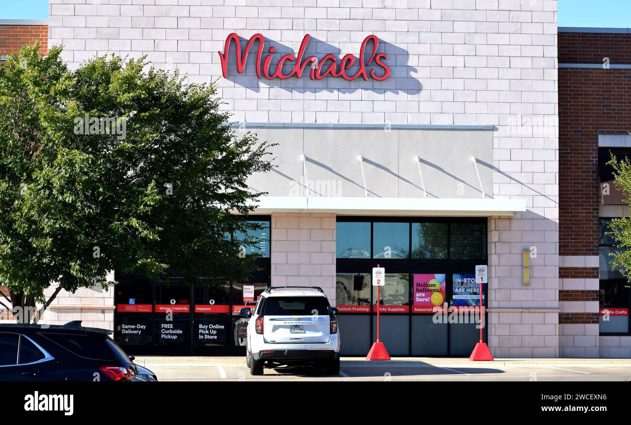 White SUV parked in front of a Michael's craft store in Southlake Texas ...