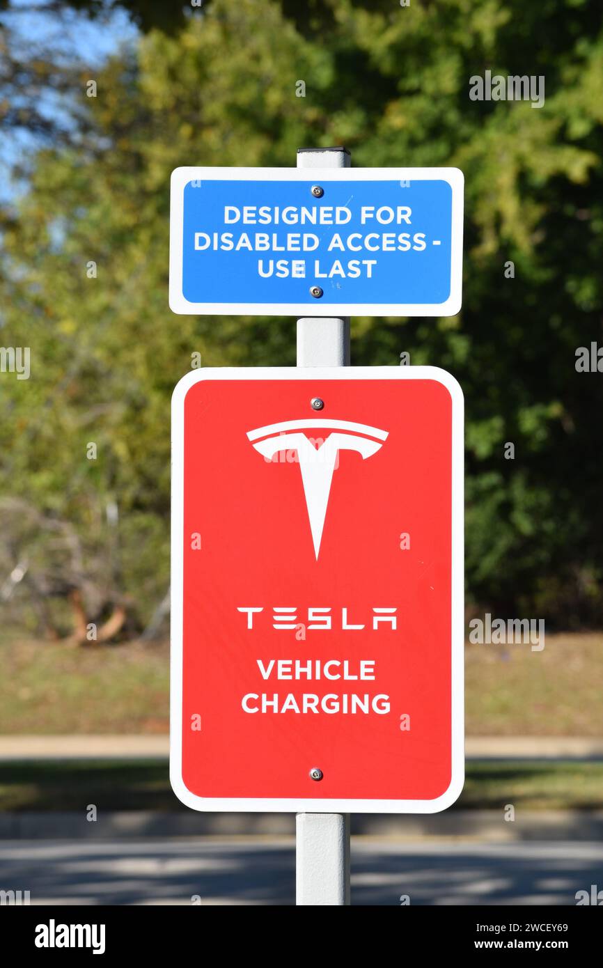 Red Tesla charging station sign on a sunny day in Southlake Texas ...