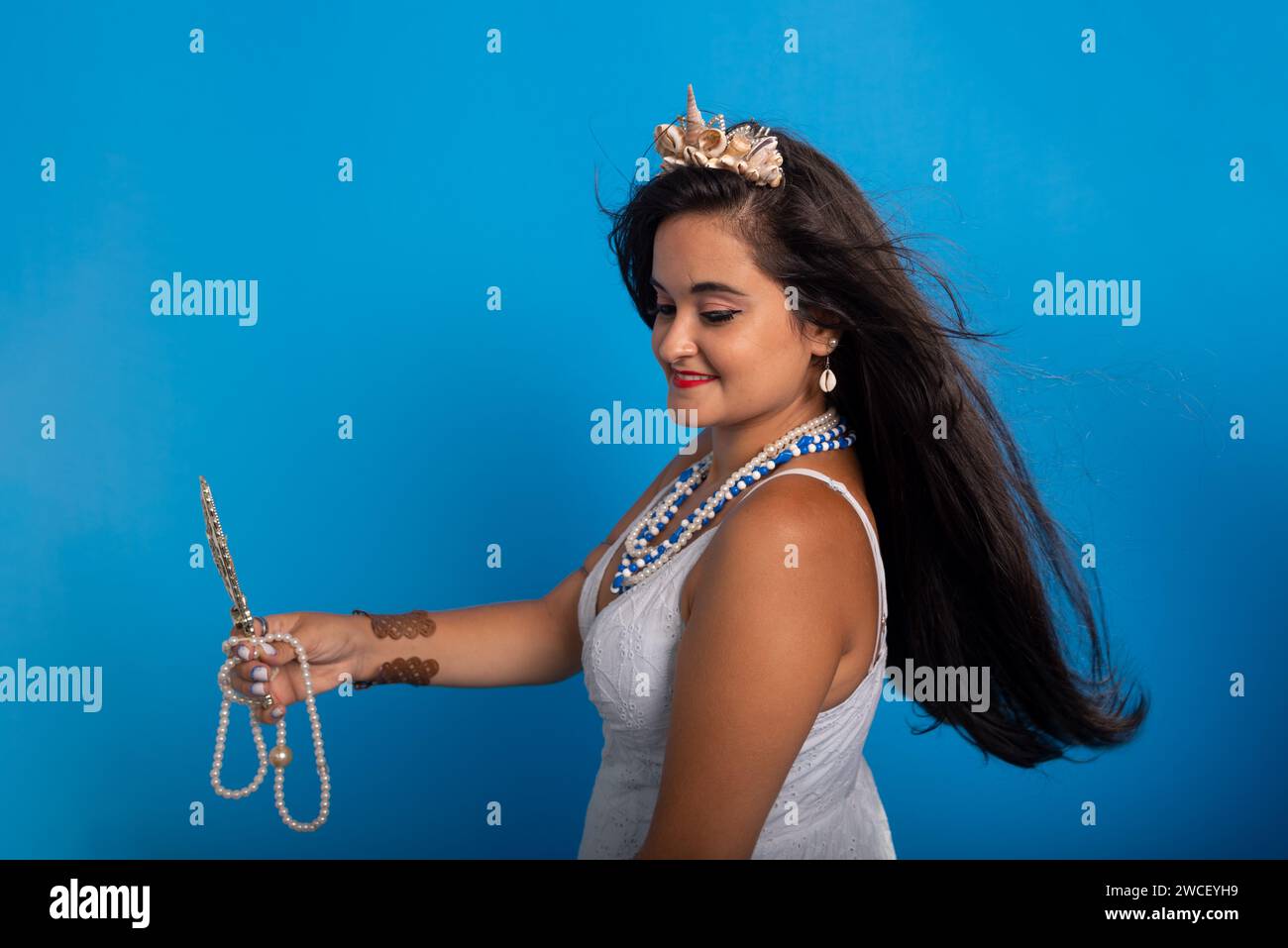 Portrait of beautiful black-haired woman wearing white clothing ...
