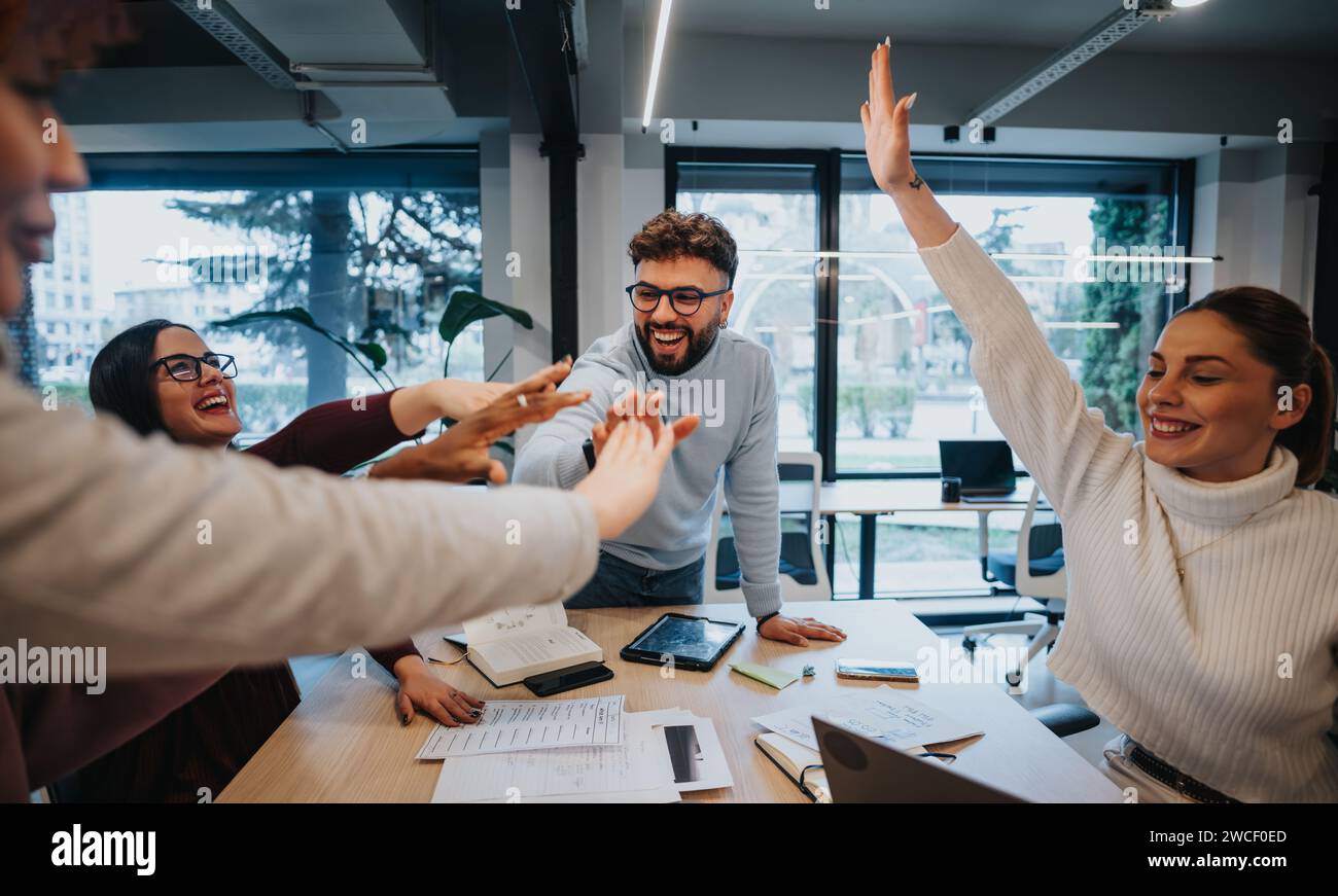 Successful business team celebrating the completion of a project Stock ...