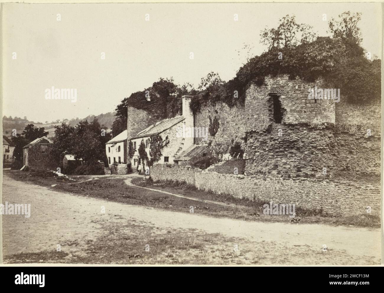 View of the ruins of a city wall with attached houses, Anonymous, 1855 ...