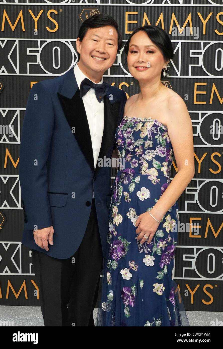 Ken Jeong, left, and Tran Jeong poses for a Red Carpet portrait at the 75th Emmy Awards on ...