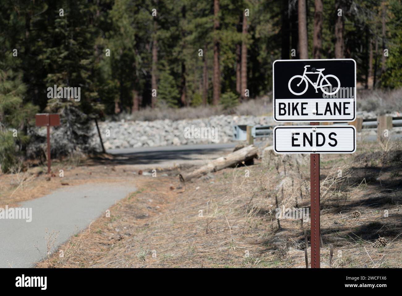 "Bike Lane Ends" sign in Sierra Nevada mountains with view of the bike ...