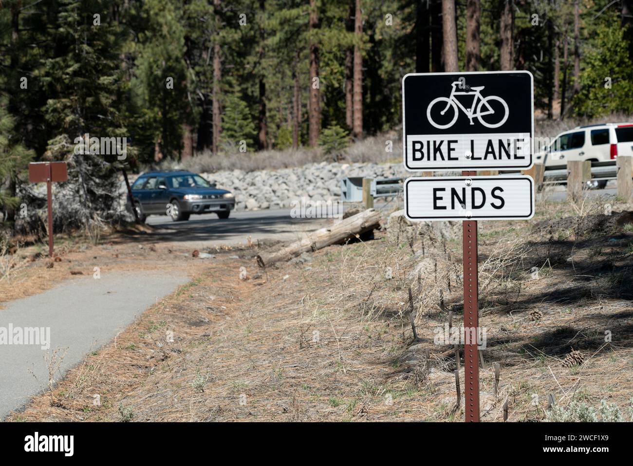 "Bike Lane Ends" sign in Sierra Nevada mountains with view of the bike ...