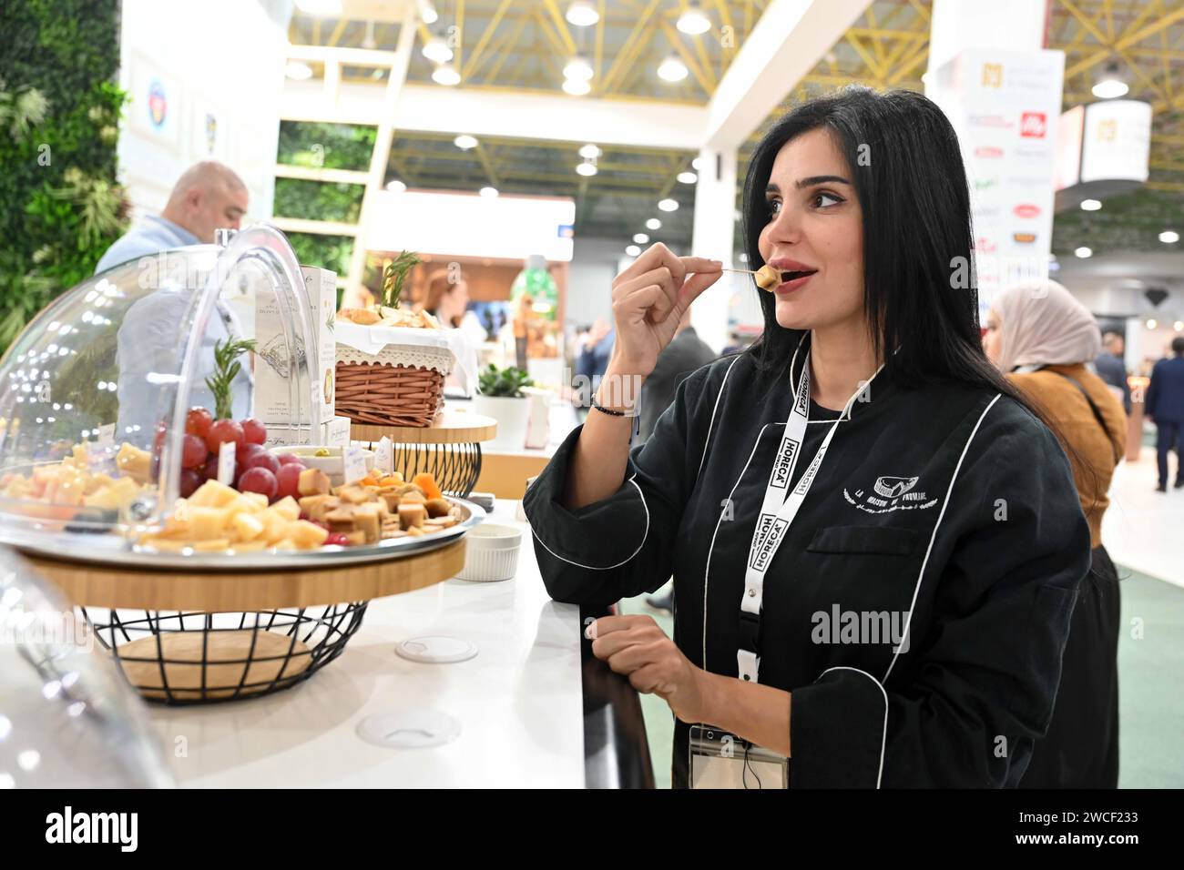 Hawalli, Kuwait. 15th Jan, 2024. A woman tastes food during the HORECA ...