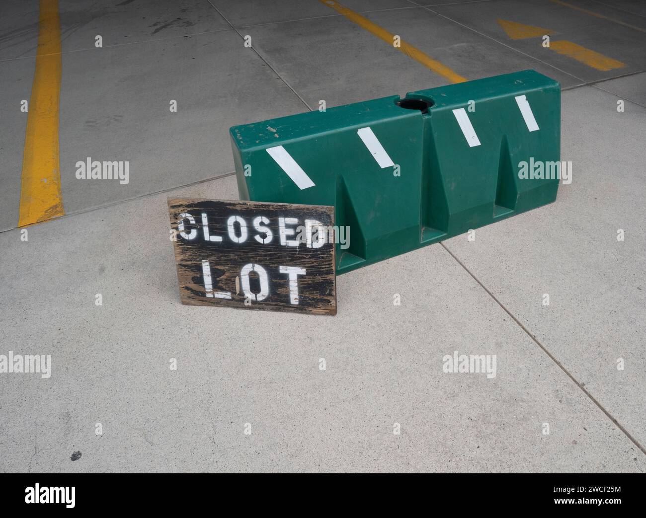 Looking down at "Closed Lot" sign with barrier blocking access Stock ...