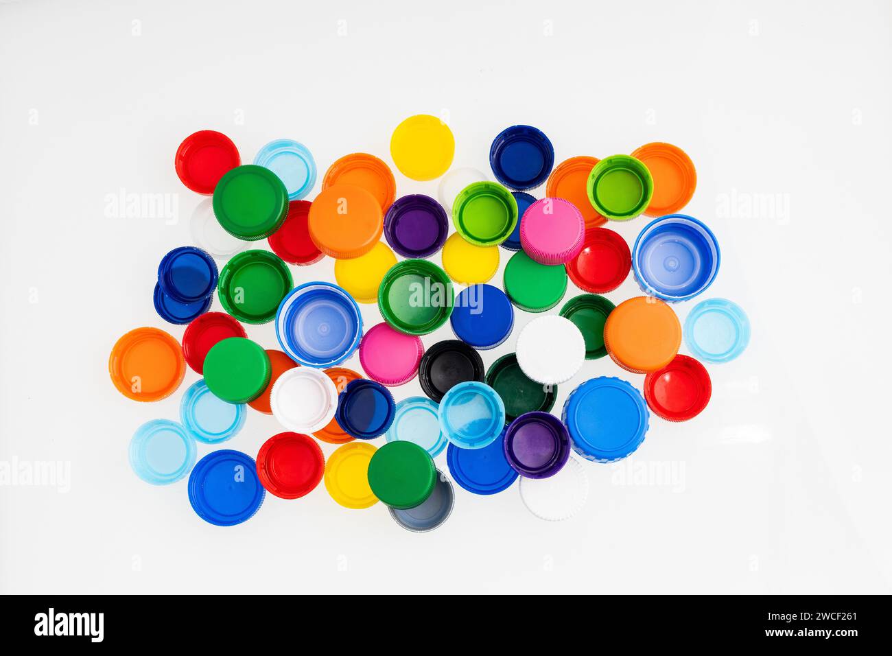 Plastic bottle caps of different colors for recycling - White ...