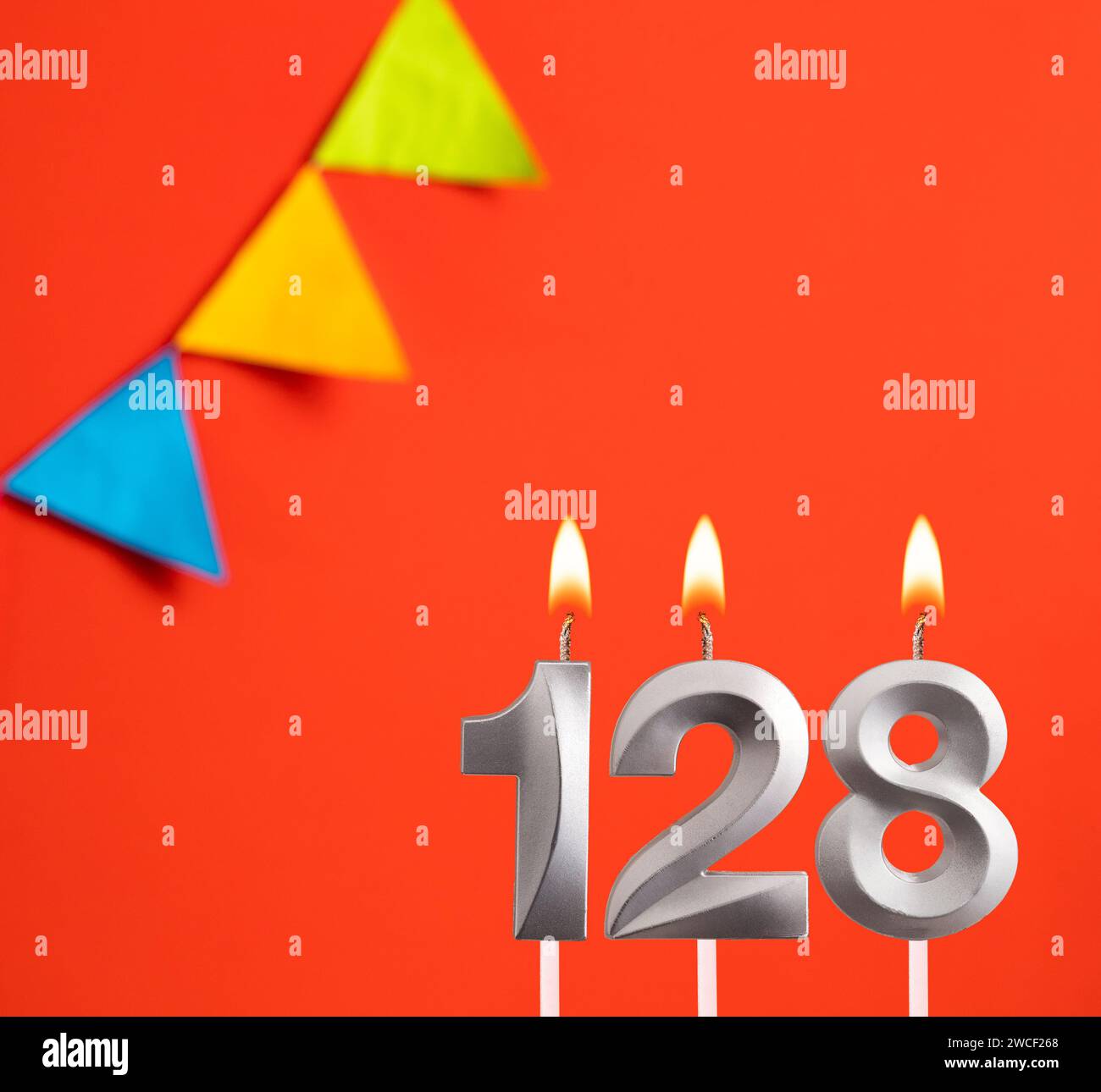 Birthday card - Number 128 candle in orange background Stock Photo - Alamy