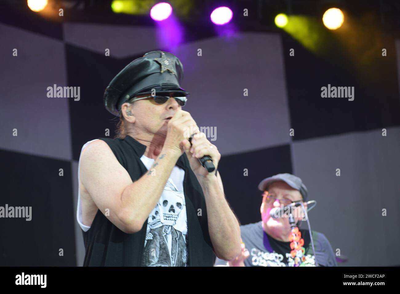 Cheap Trick performs in Sherman Texas, during what would become a rain ...
