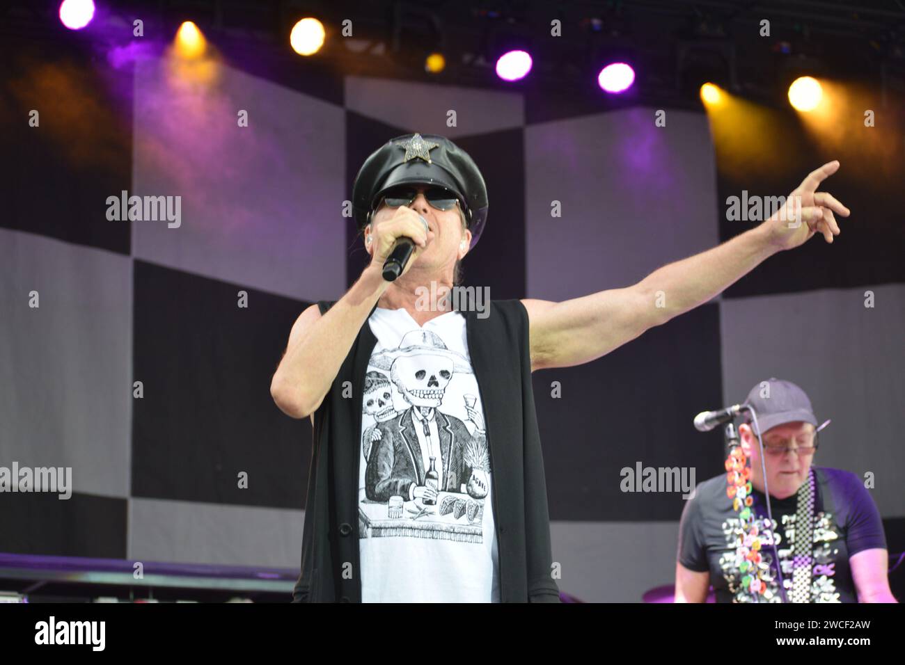 Cheap Trick performs in Sherman Texas, during what would become a rain ...