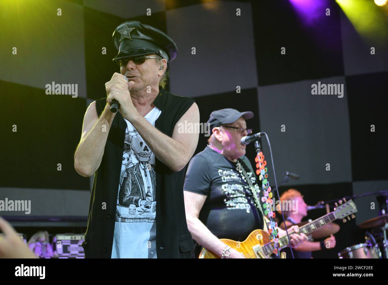 Cheap Trick performs in Sherman Texas, during what would become a rain ...