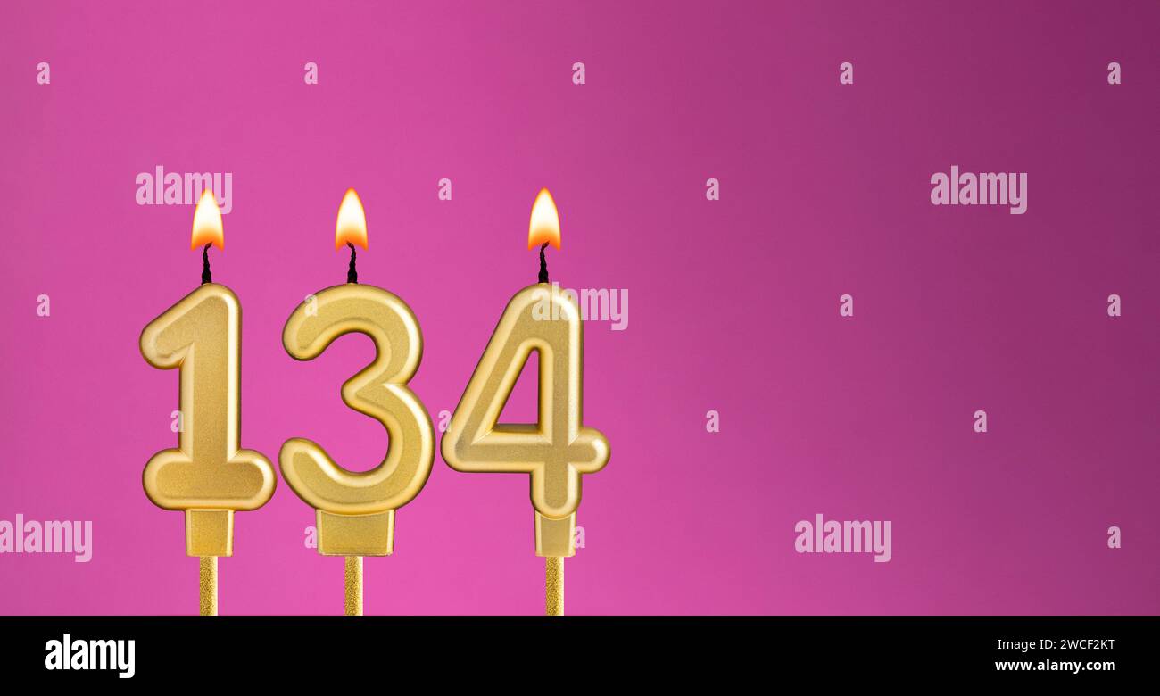 Candle number 134 in purple background - birthday card Stock Photo - Alamy